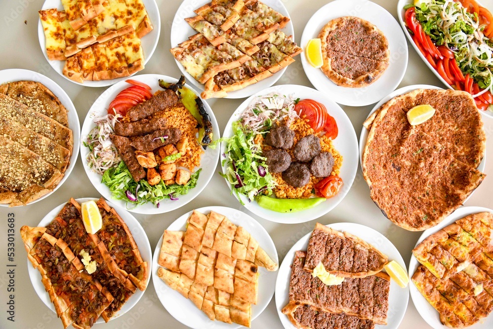 Traditional Turkish cuisine. Pizza, pita, pidesi, sucuk, hummus, kebab ...