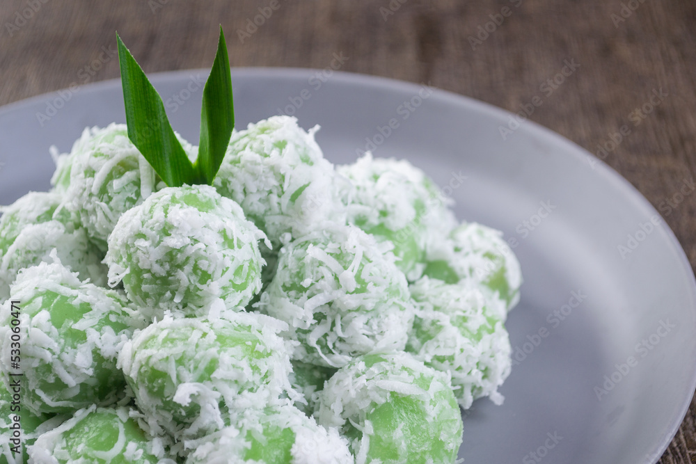 Klepon pandan is a snack of sweet rice cake balls filled with molten ...