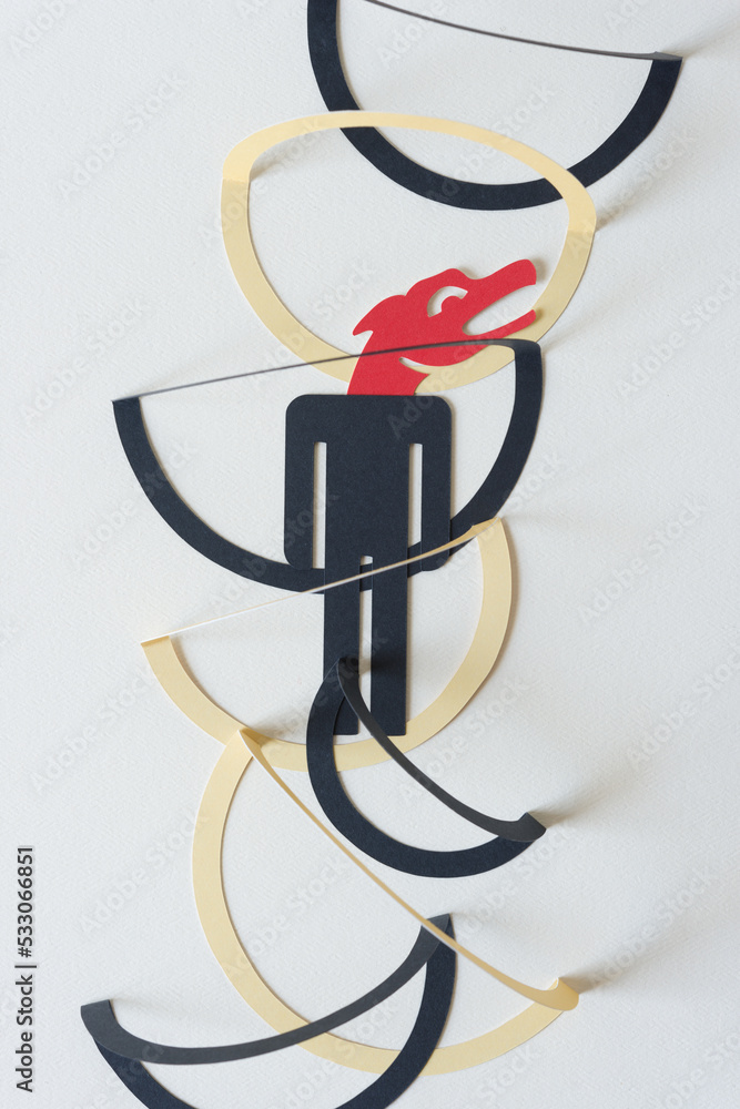 stick figure dingbat with head of a dragon and folded paper rings on ...