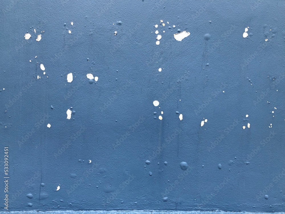 weathered facade outdoor wall. The layers of paint peeling off and ...
