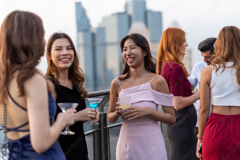 Foto de Photo of a group of young elegant businesswomen mingle with ...
