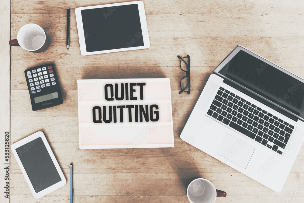 Quiet Quitting message text in vintage style light box on office deskt ...