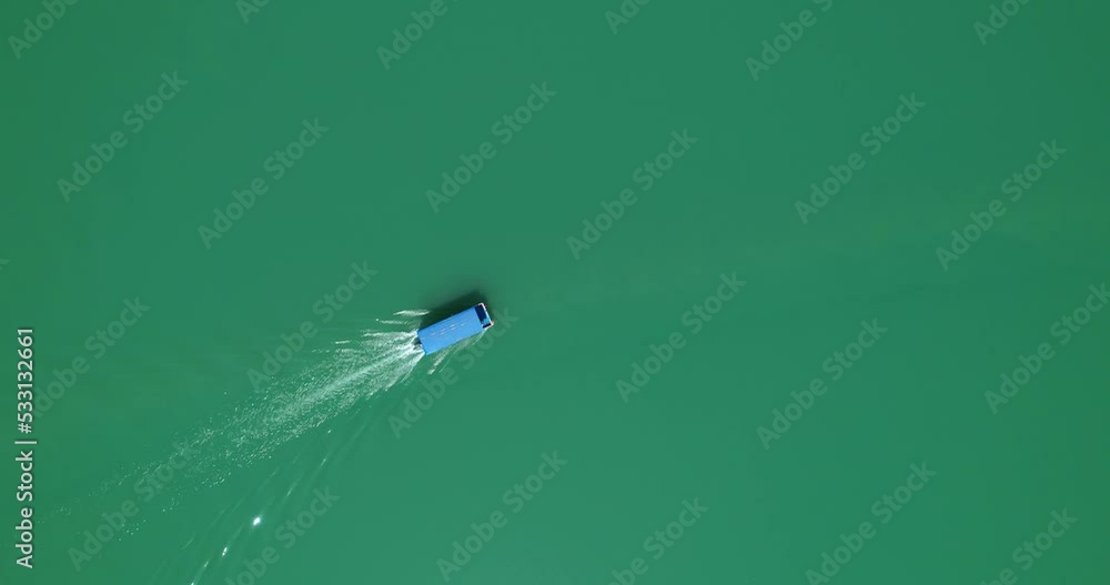 A pleasure boat on the water surface of the lake. A motor boat with a ...