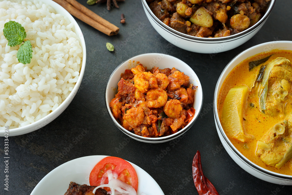 Top view spicy hot Bengali Prawn roast , shrimp masala fish curry, rice ...