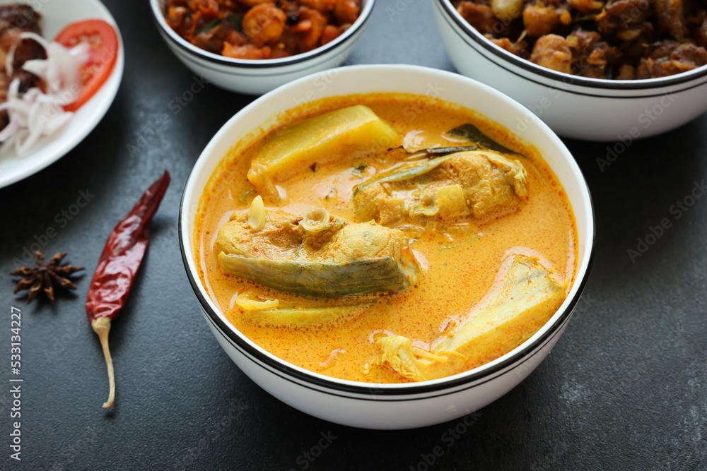 Kerala fish curry coconut milk gravy , cooking spicy Goan fish curry ...