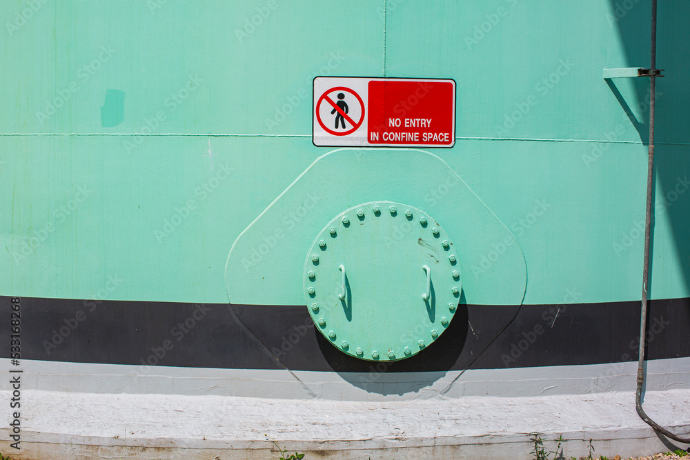 Tank green confined space entry with warning Stock Photo | Adobe Stock