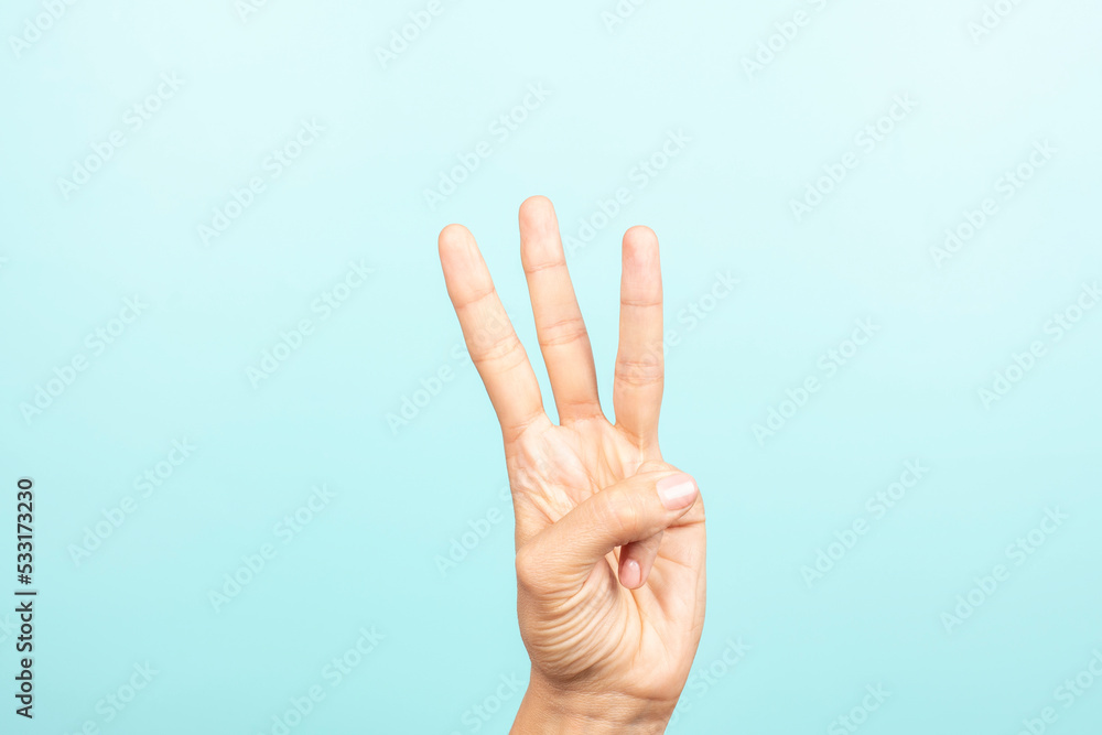 Hand gesture. Female hand shows number three. Woman hand pointing up ...