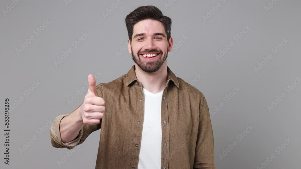 Back rear view smiling happy satisfied young man 20s he wear brown ...