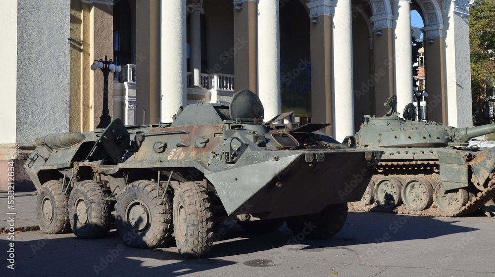 Armored personnel carrier and tank stand on the street Stock Photo ...