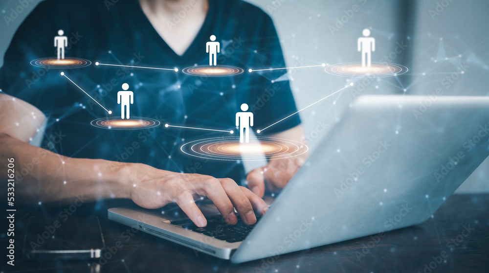 Man using laptop with graph market stock and Human or people icon on ...