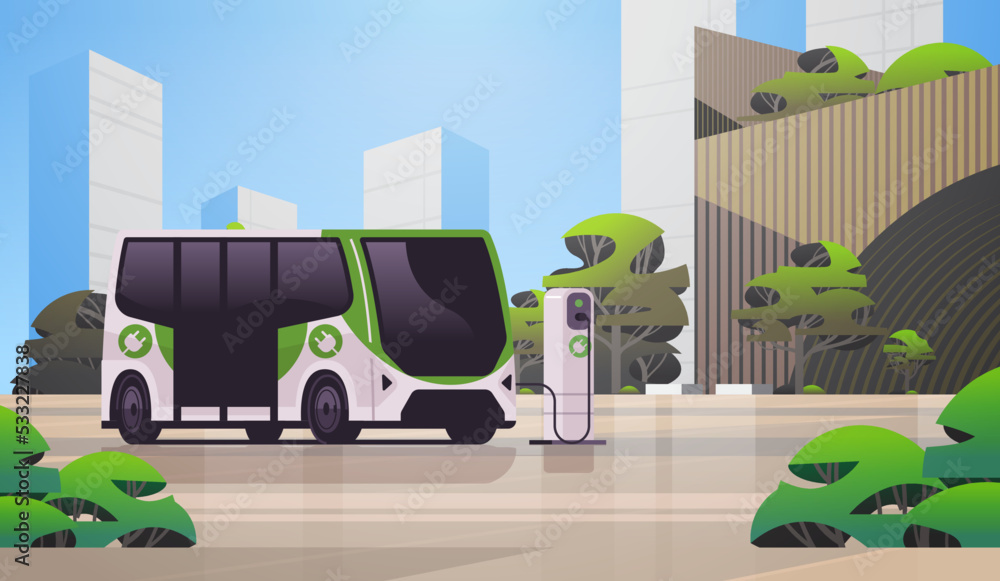 electric bus charging parking at the charger station with a plug in ...