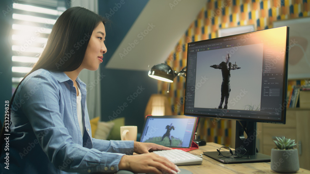 Asian female 3D designer making animation for video game character ...