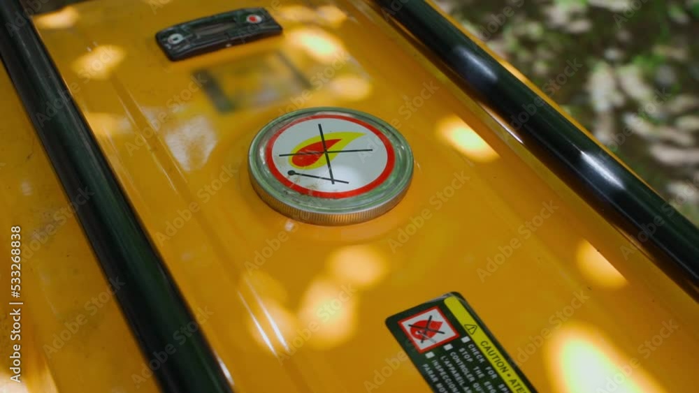 Filler cap of an orange gas tank close-up. Flammable hazardous material ...