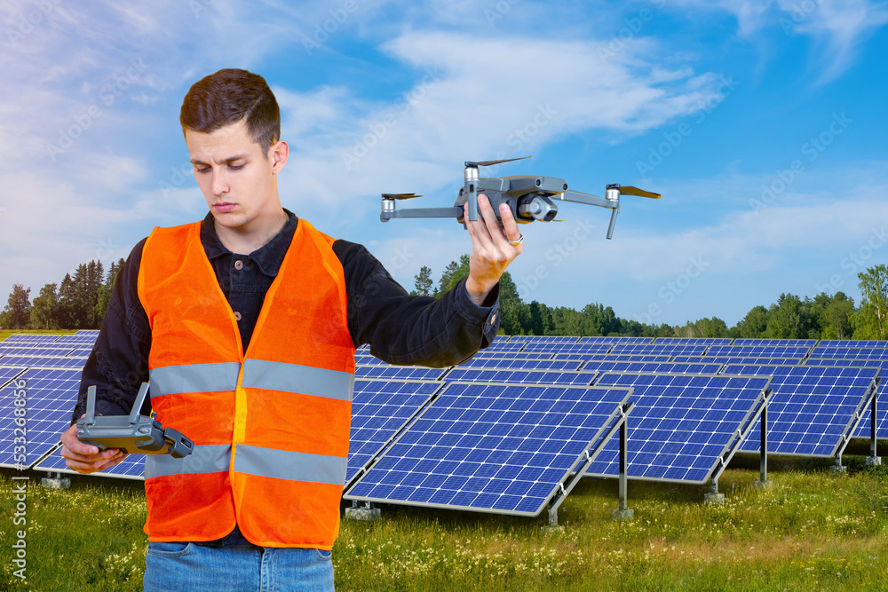 Maintenance solar power plants. Man with drone. Engineer launches ...