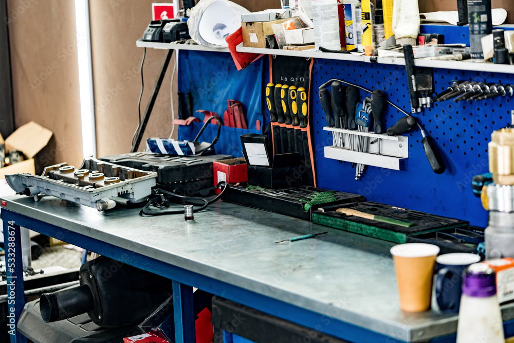 Large workbench with tools at station for vehicle technical servicing ...