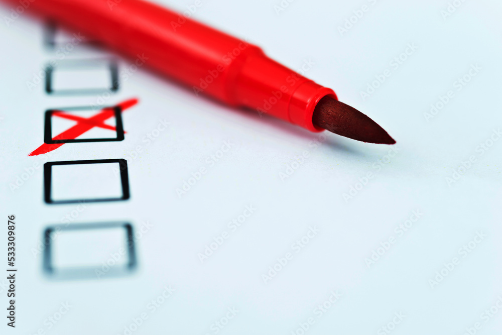 Red pen marks checkbox with a cross Stock Photo | Adobe Stock