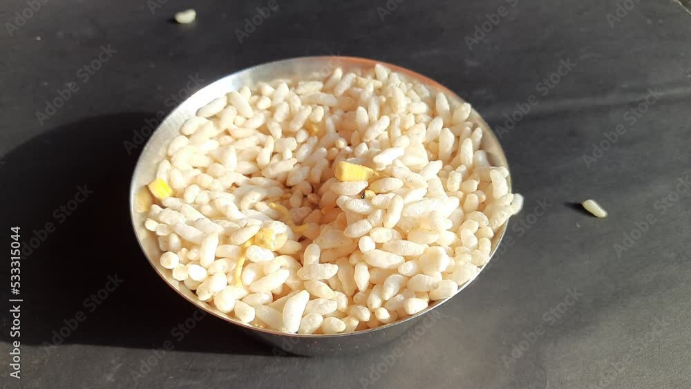 Puffed rice or popped rice. Its puffed grain made from rice. A ...