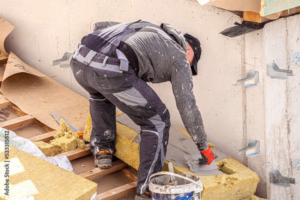 Building insulation. Glass wool is an insulating material made from ...