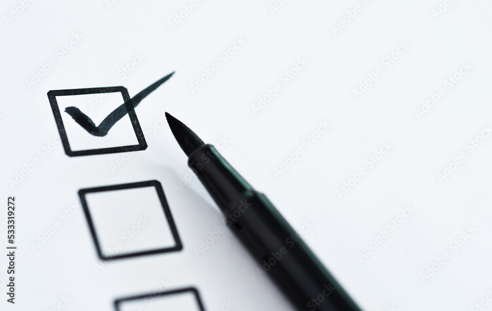 Tick box and pen isolated on white paper Stock Photo | Adobe Stock