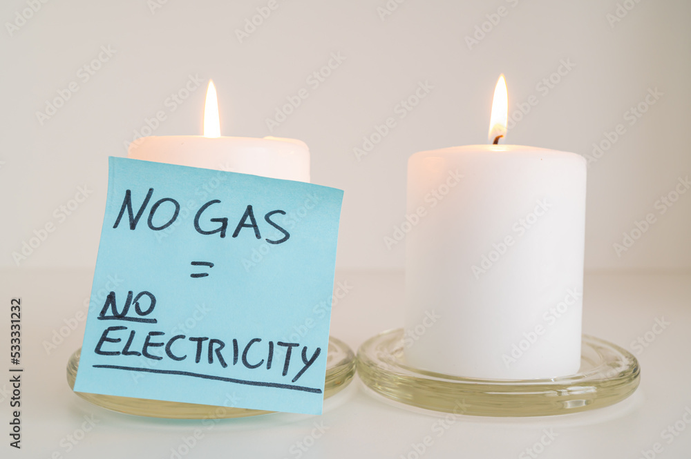 Fotka „Lighted candles, with blue ticket and text "no gas, no ...