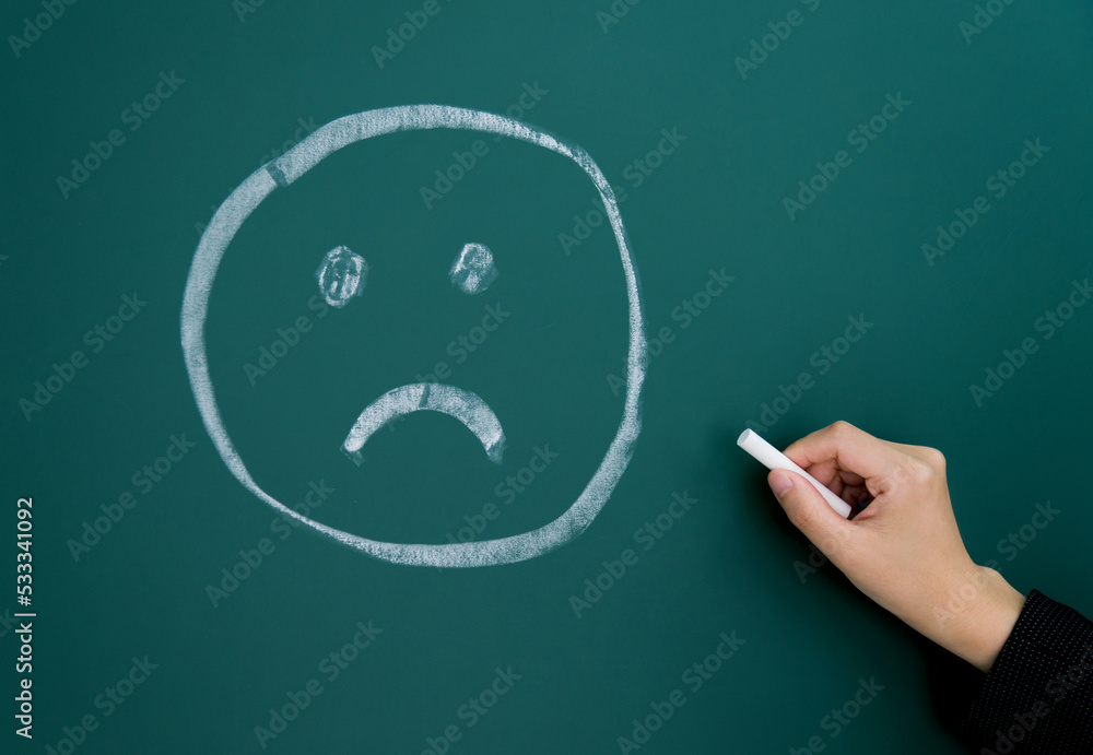 Hand drawing sad face on background Stock Photo | Adobe Stock