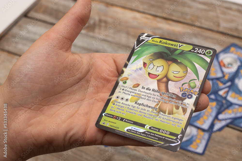 Boy holding card from special boy of pokemon trading cards Stock Photo ...