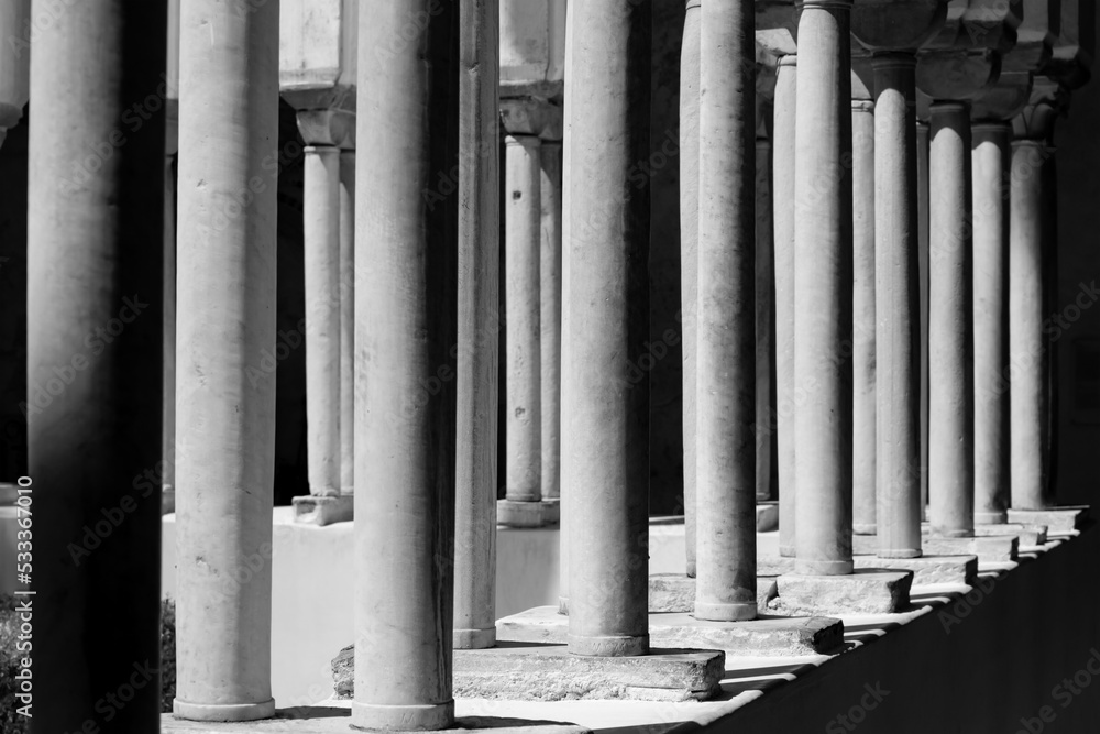 Columns and arches in the cloister of the “Cattedrale di Sant'Andrea ...