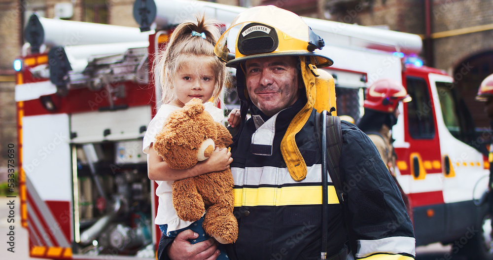 Portrait of caucasian handsome fireman in helmet and gull equipment ...