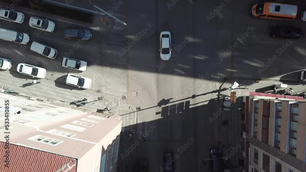 Aerial view of the road junction at the city center. Vehicles are ...