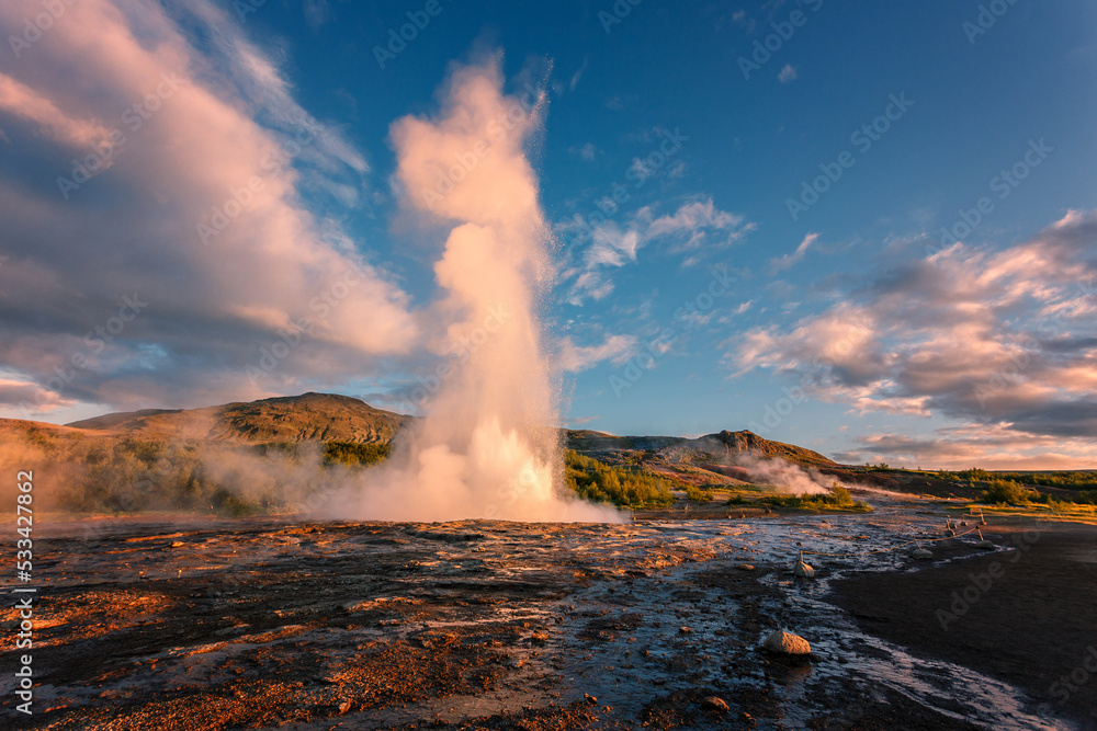 Stunning Eruption of Strokkur Geysir in Iceland during sunset. Strokkur Geyser Popular touristic ...