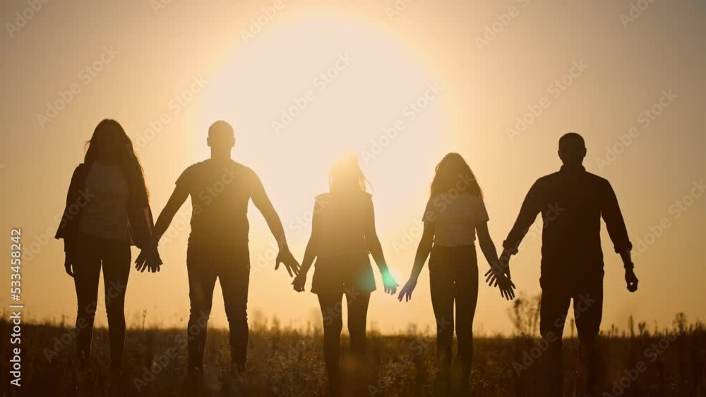 teamwork. team community a holding hands together silhouette at unity ...