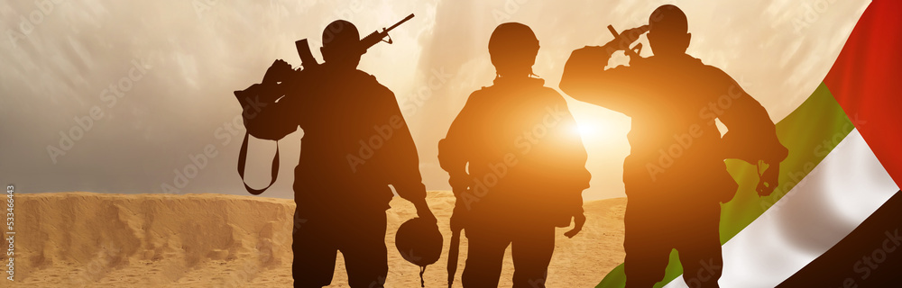 Silhouette Of A Solider Saluting Against the flag of UAE. Concept of ...