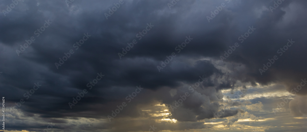The dark sky with heavy clouds converging and a violent storm before ...