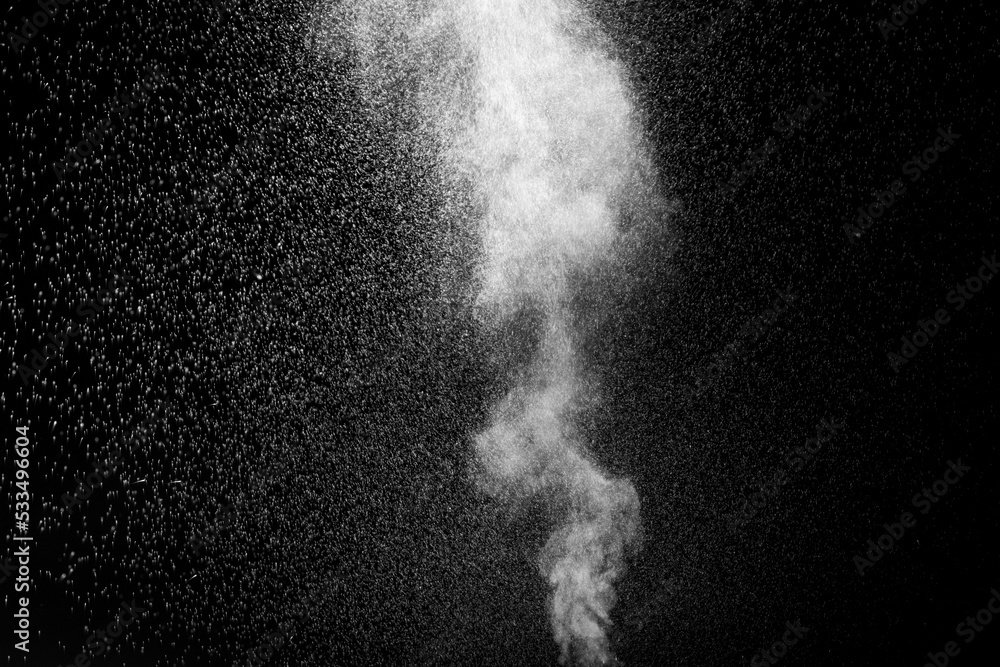 Curly white steam rising up and splashing water scattering in different ...