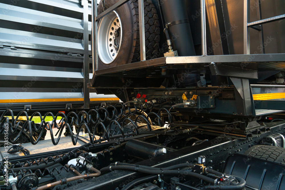 Spiral cable connecting truck cabin and trailer. Pneumatic hoses and ...