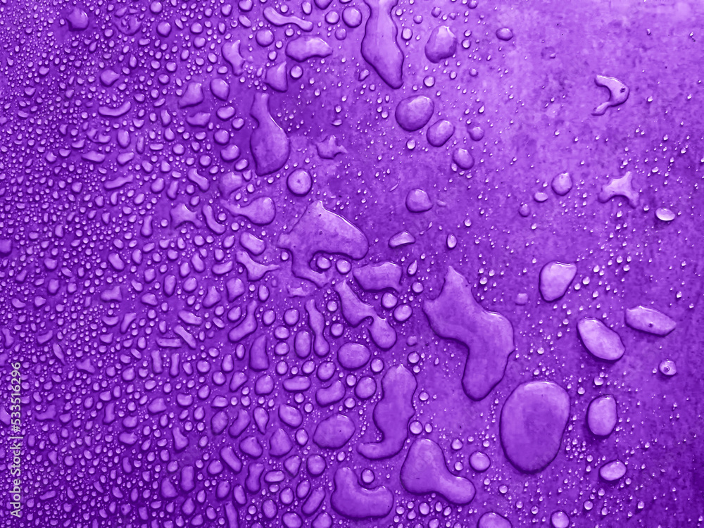 water drops of different sizes on a purple surface, drops texture, rain ...