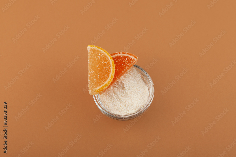Pectin gum powder in glass bowl, top view. Food additive E440. Citrus ...