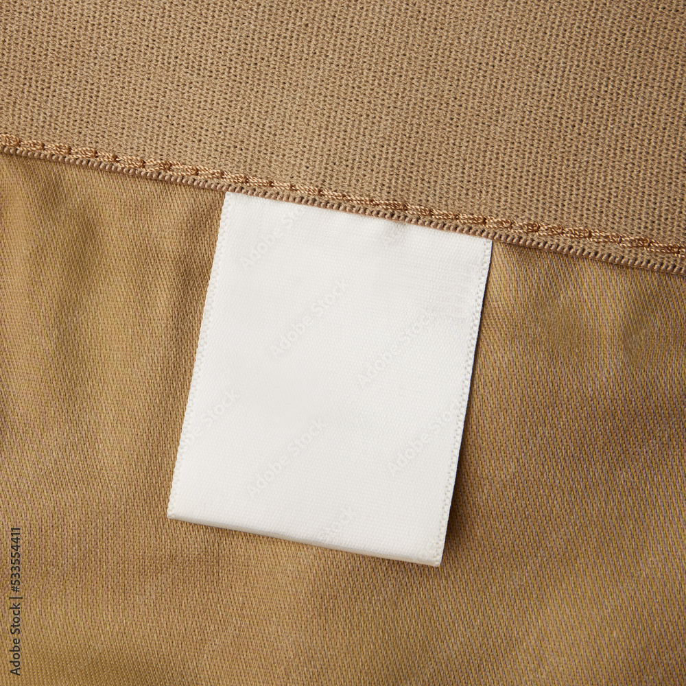 blank white color clothing label on brown t shirt Stock Photo | Adobe Stock