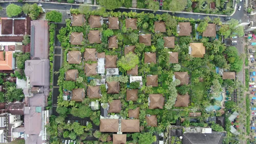 Luxury villa rooftops in resort area of Bali, aerial top down view ...