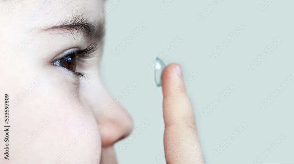 cute little boy putting contact lenses hold in finger.close up child ...