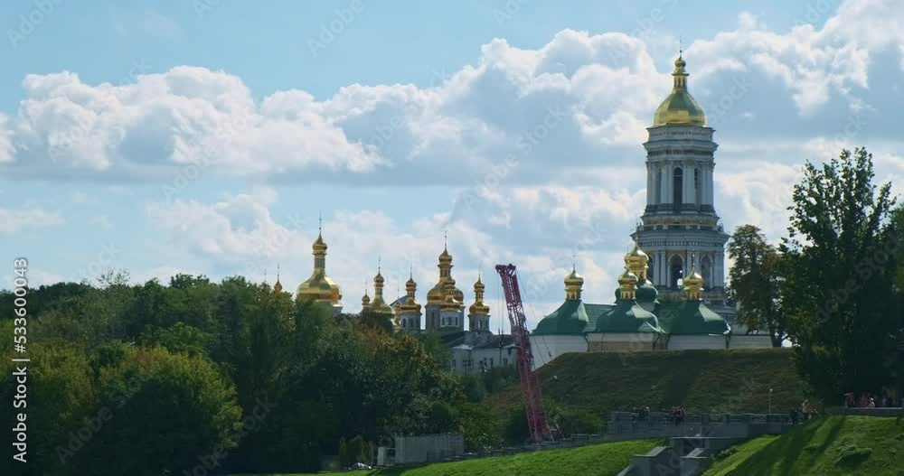 Many orthodox golden domes of church bell towers, blue sky with white ...