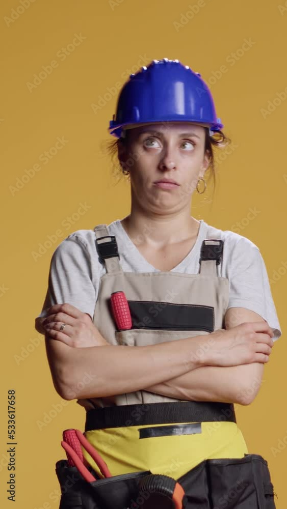 Vertical video: Portrait of light headed contractor being hit in head ...