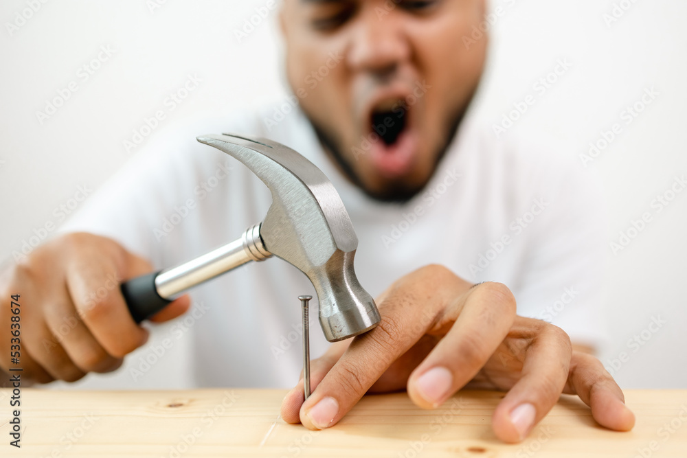 The carpenter was injured by hammer and nails. He misused the hammer ...