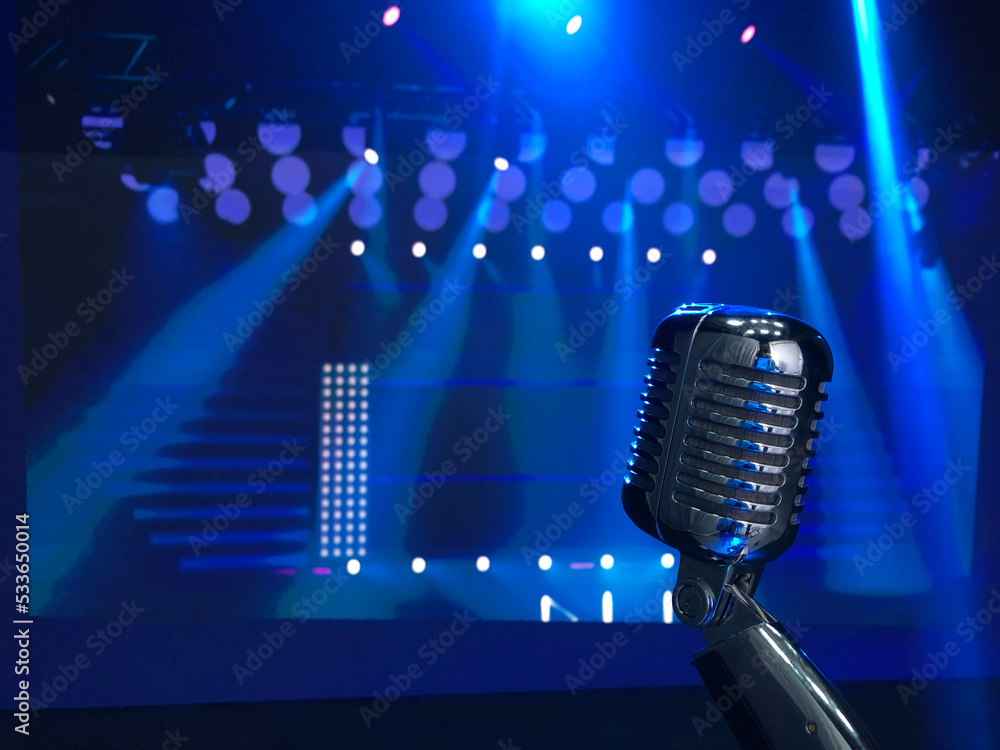 Singer microphone on stage in blue lights, performing live on scene in ...