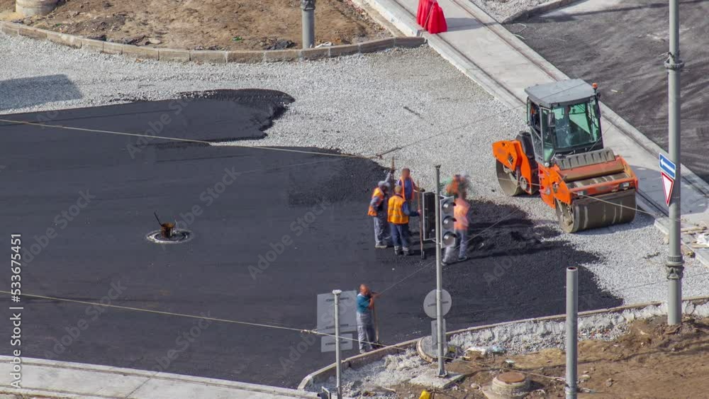 Asphalt paver, roller and truck from above. Construction site of avenue ...