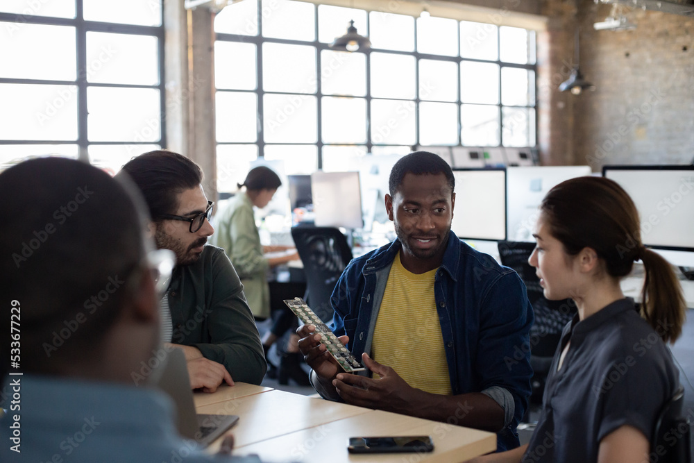 Team of engineers developing technology for robotics Stock Photo ...