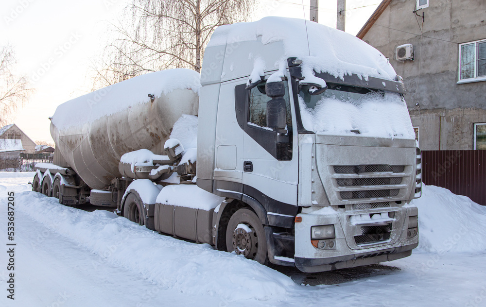 Truck covered with snow in winter Stock Photo | Adobe Stock