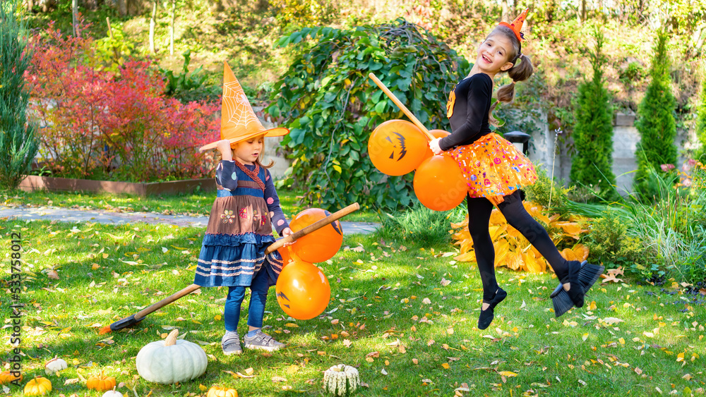 A girl dressed as a witch flies on a broomstick. Fun Halloween party ...