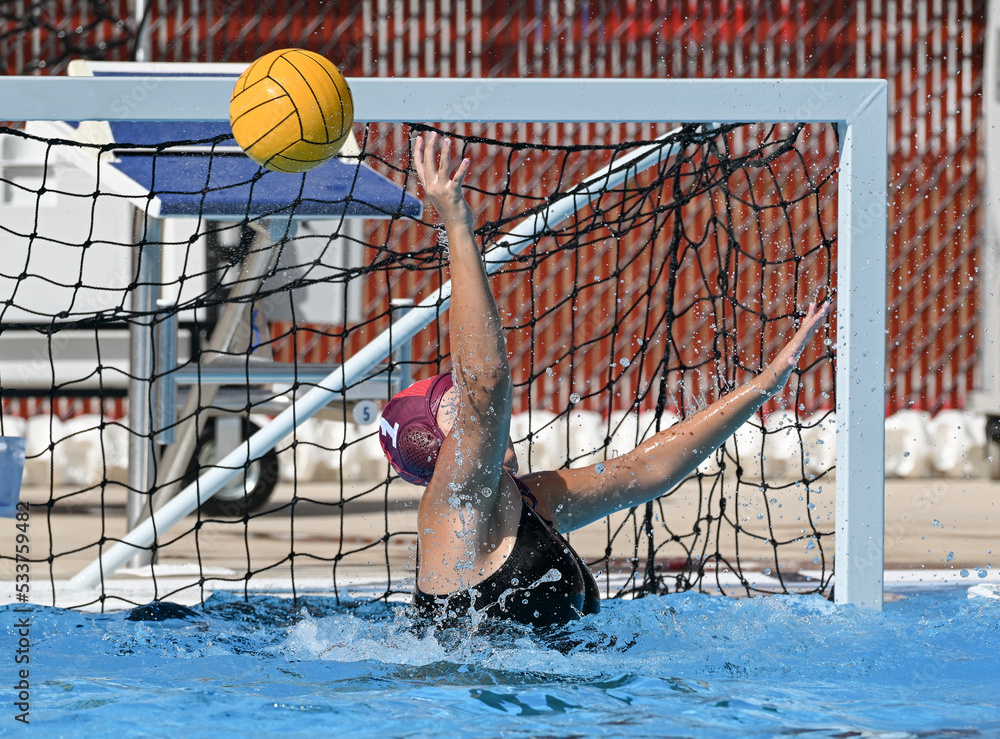 Young teen girls playing a competitive game of waterpolo Stock Photo ...