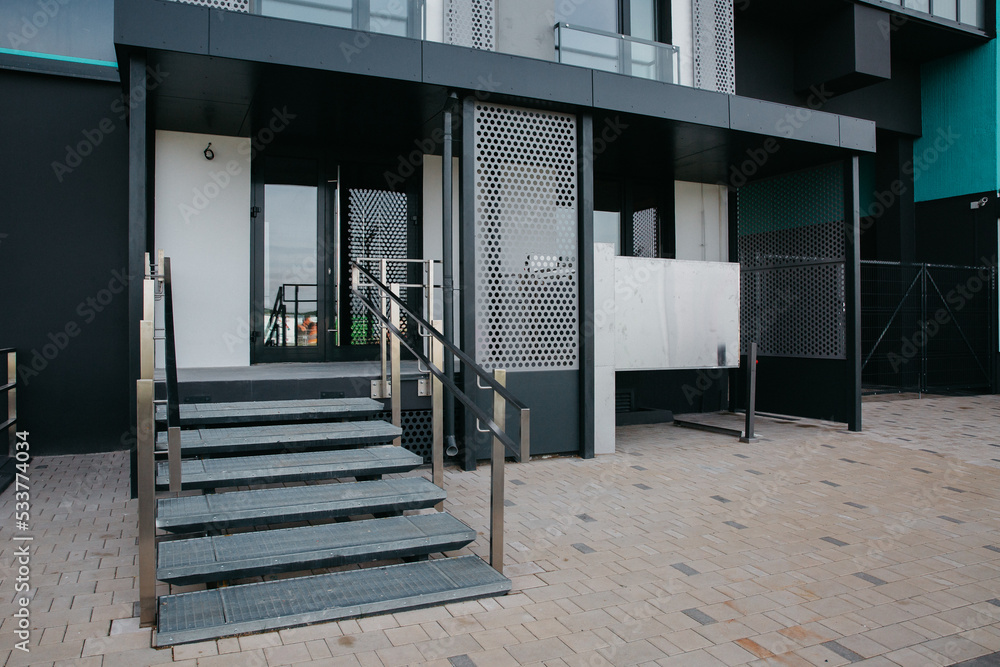 modern front door porch at the entrance and a lift for disabled people ...